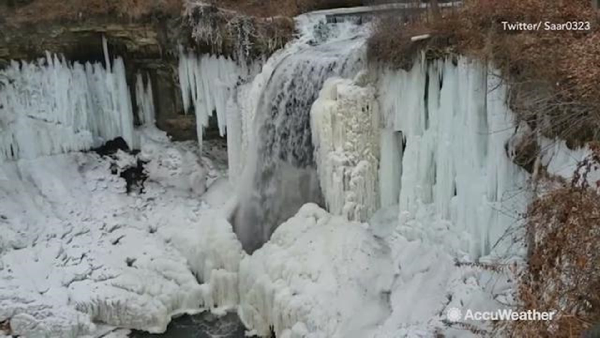 Stunning view of water racing over partially frozen waterfall | wfaa.com