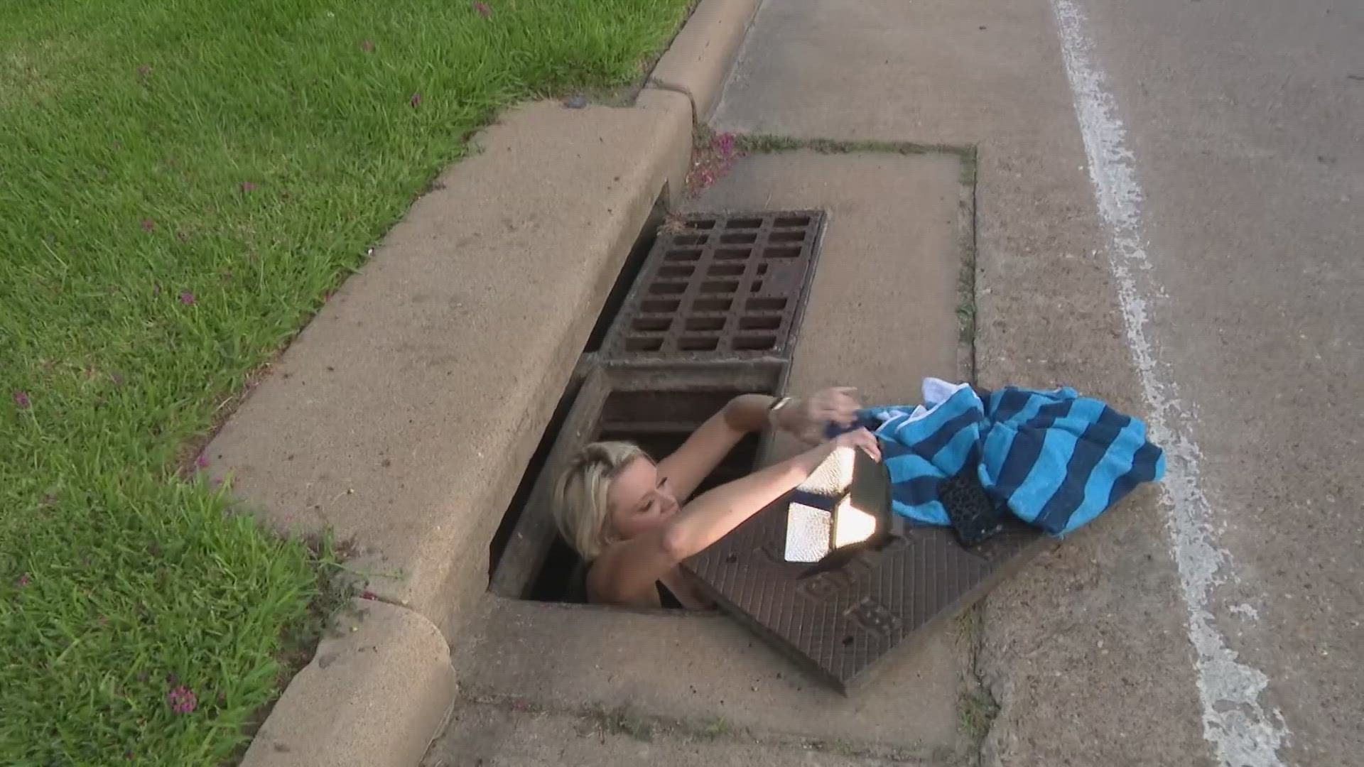 Woman rescues puppies stuck in storm drain | Houston news | wfaa.com