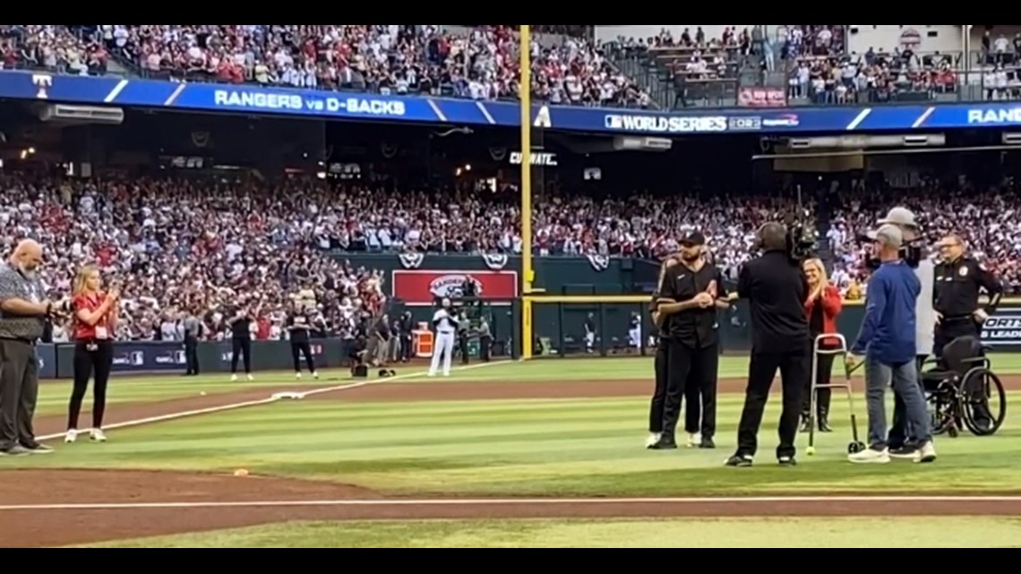 Officer Tyler Moldovan throws first pitch at World Series Game 5 | wfaa.com