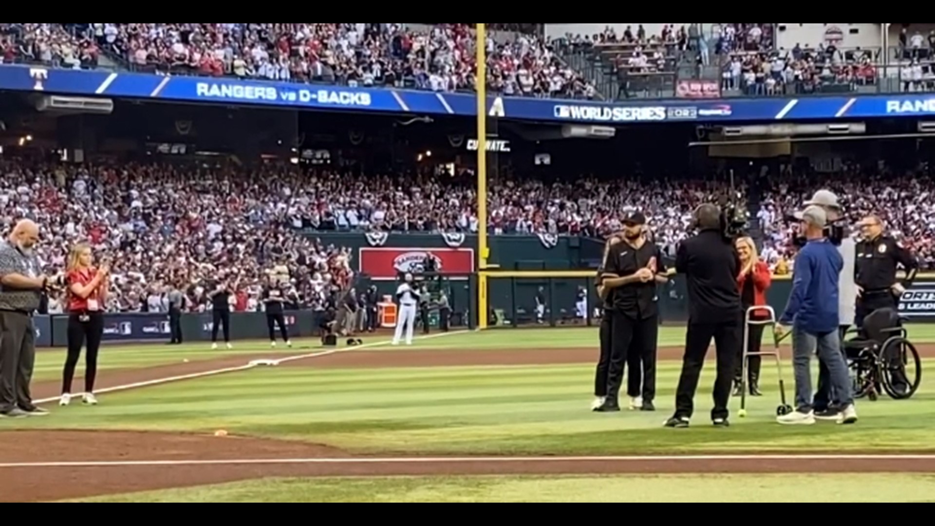 Officer Tyler Moldovan throws first pitch at World Series Game 5 | wfaa.com