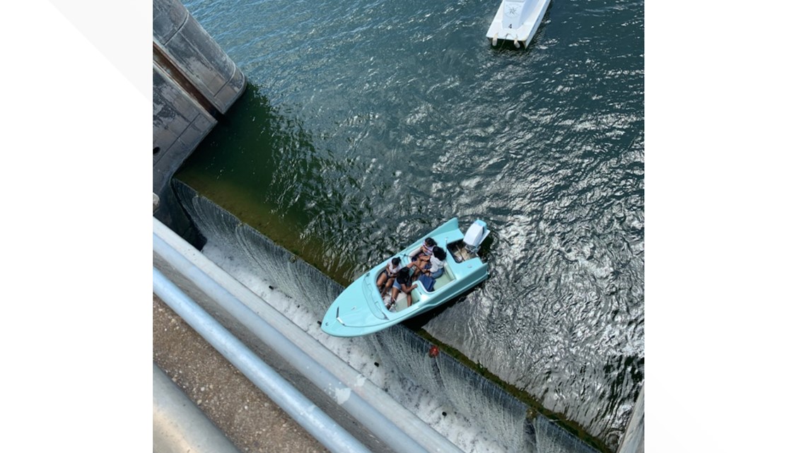 'It looks like it's going to go over the dam' | Women stuck on boat at ...