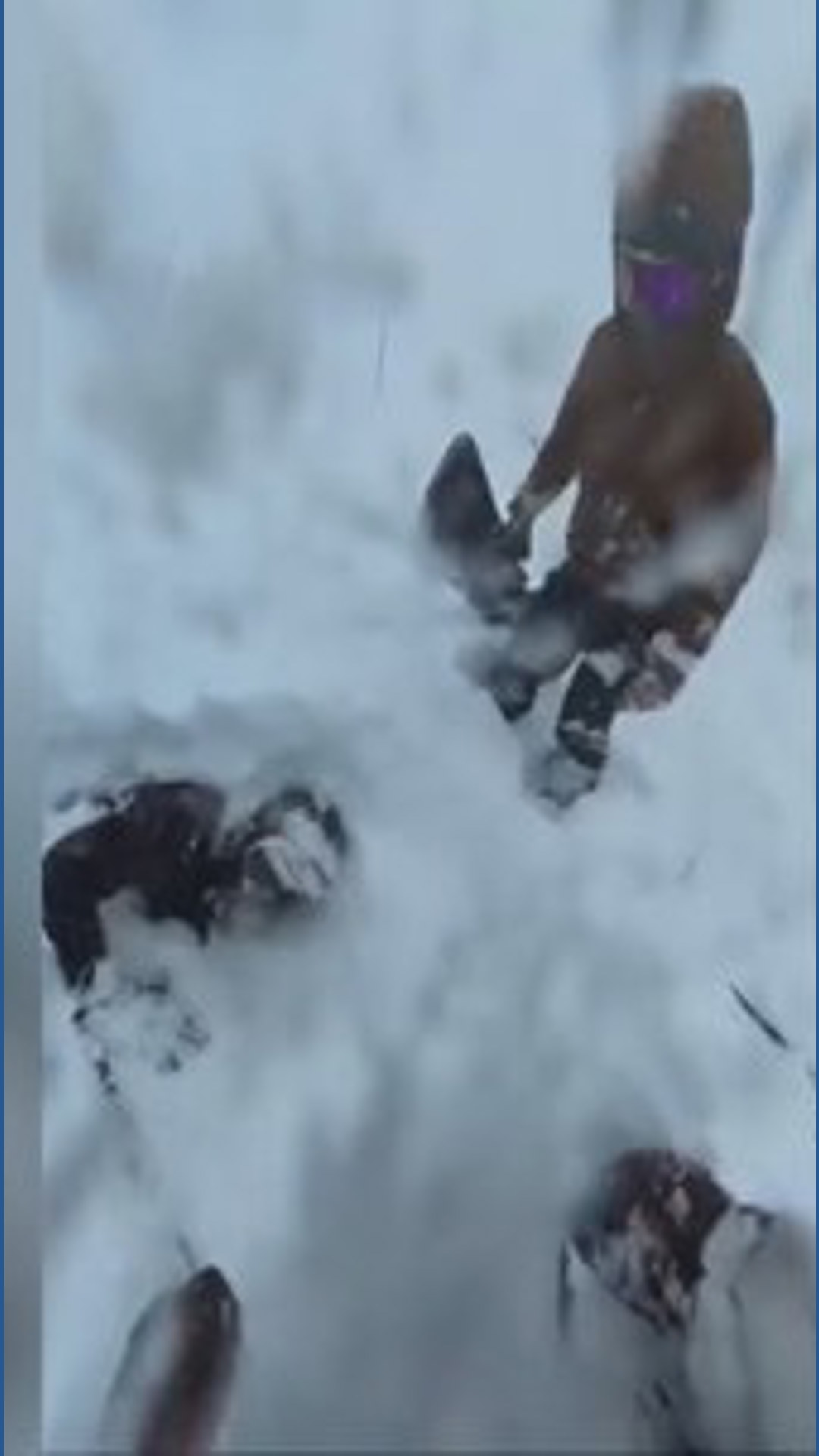 Skiier helps rescue another man who was stuck upside down in deep snow ...