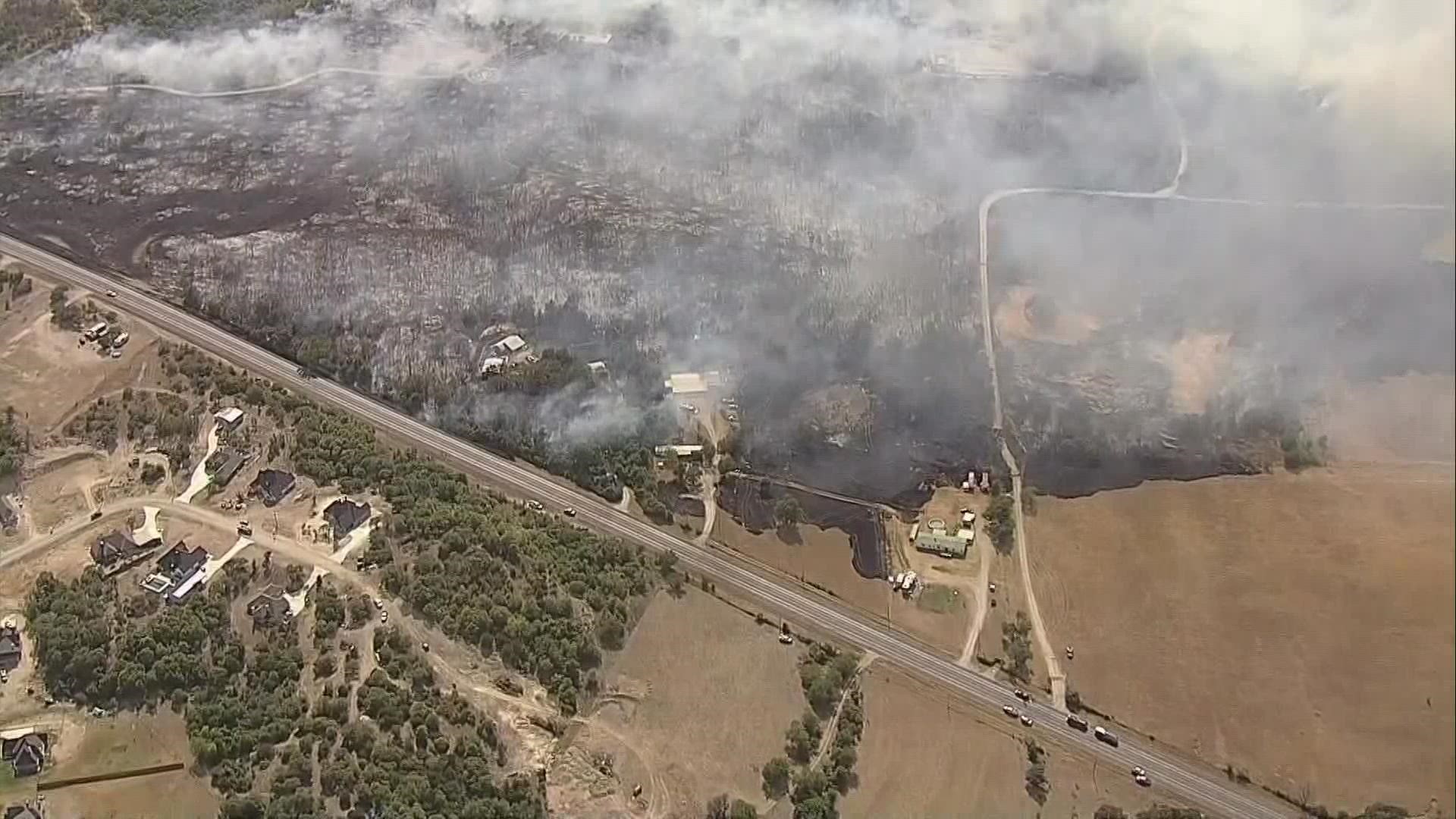 Parker County crews working to put out large grass fire | wfaa.com