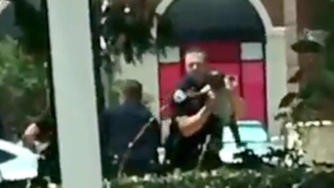 Cops rescue baby from woman accused of dousing bank lobby in gas during ...