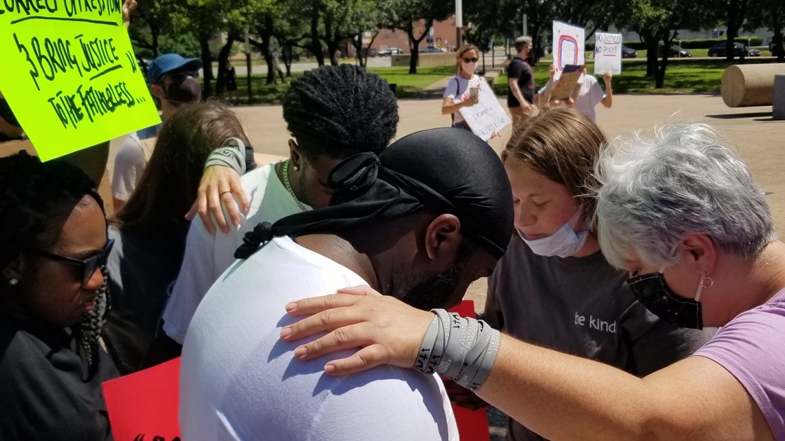 Large crowd gathers to march in silent protest outside Dallas City Hall ...