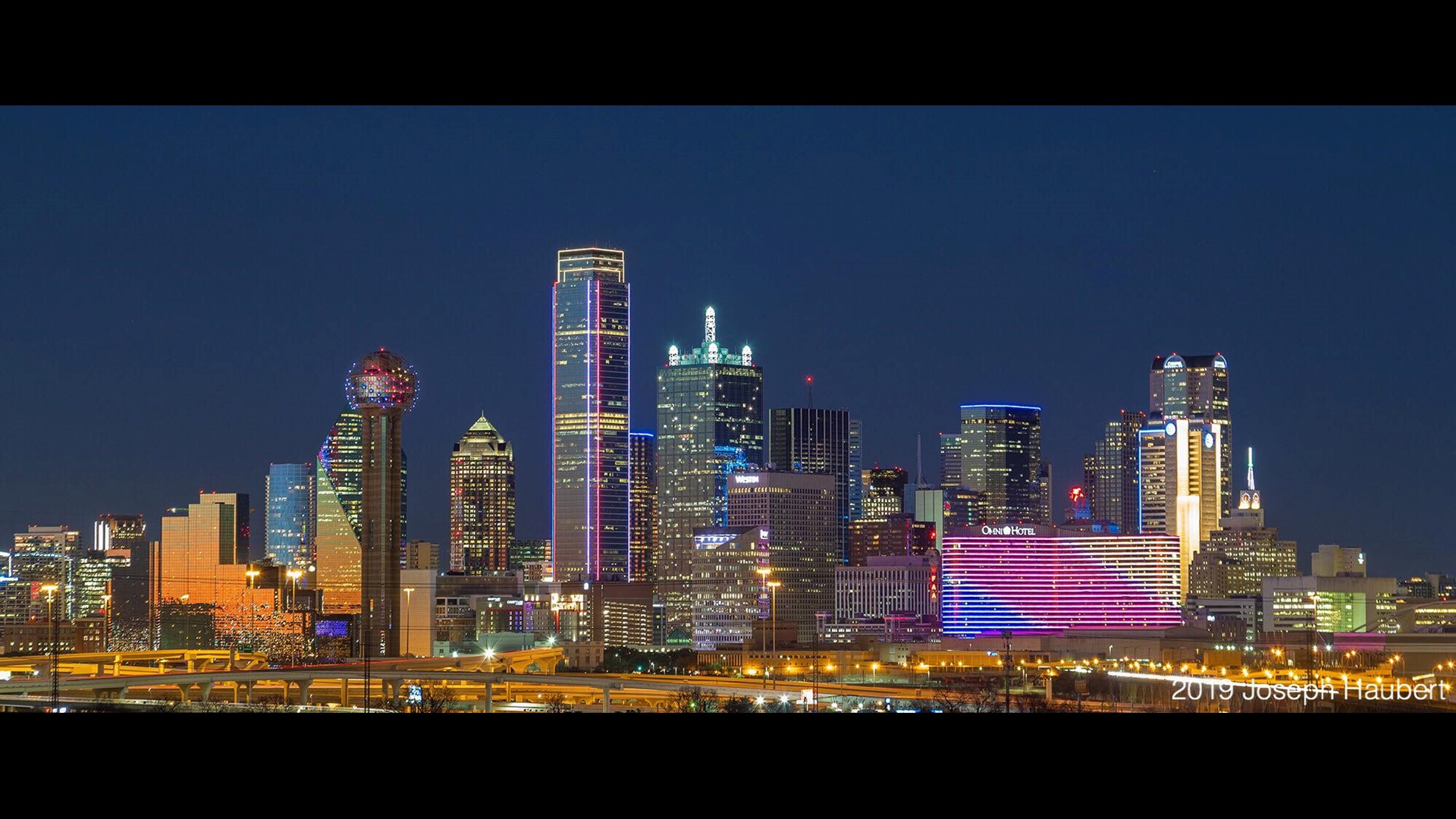 Dallas skyline lights up in Southwest colors in tribute to Herb ...