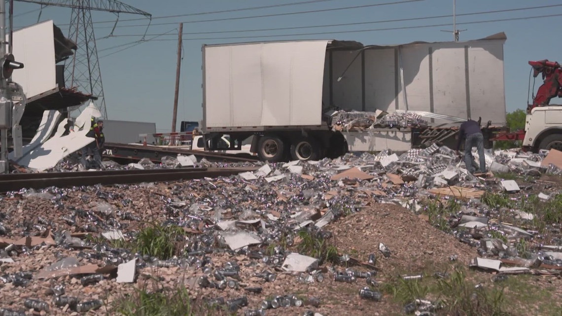 Train slams into semi truck, spilling beer across the roadway in North ...