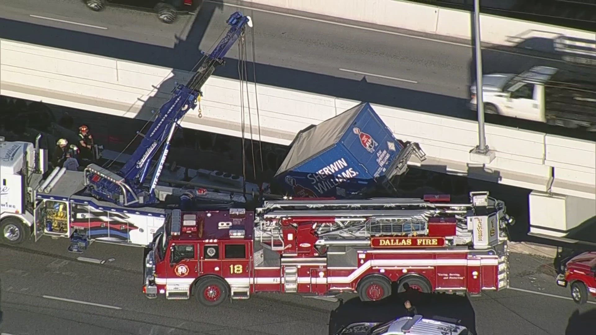 Driver rescued after truck crashes off I-35 bridge in Dallas; major ...