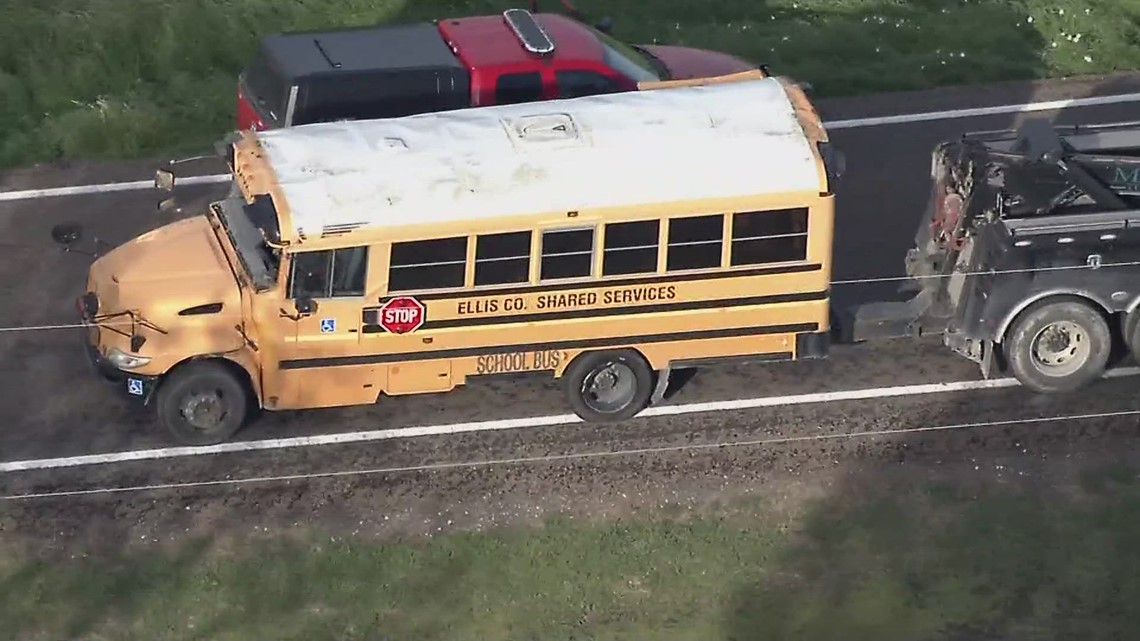 School bus landed on its side after colliding with a Maserati in Ellis ...