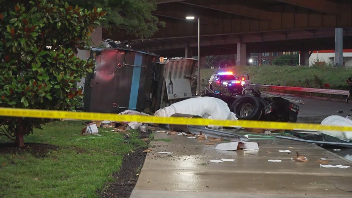 Downtown Dallas crash causes big rig to dangle over bridge | wfaa.com