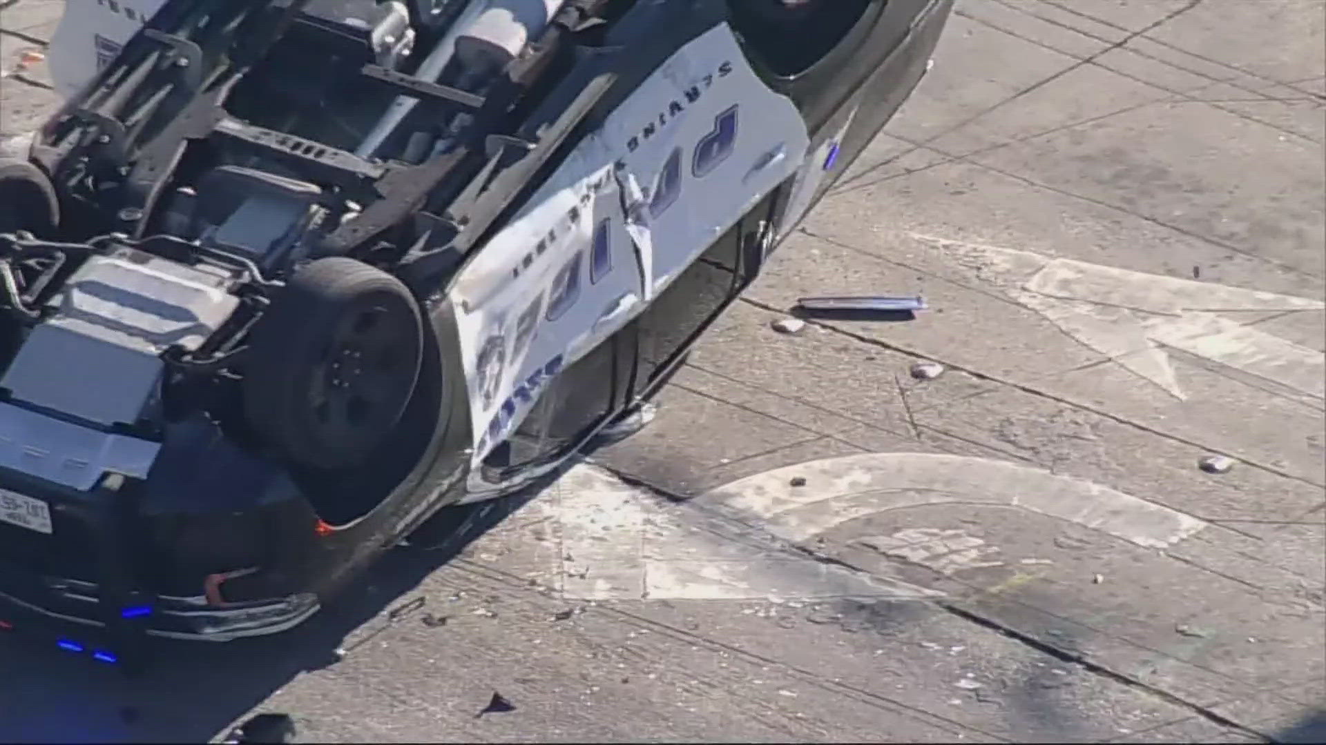 Dallas police vehicle flipped after crash, 2 officers hospitalized ...