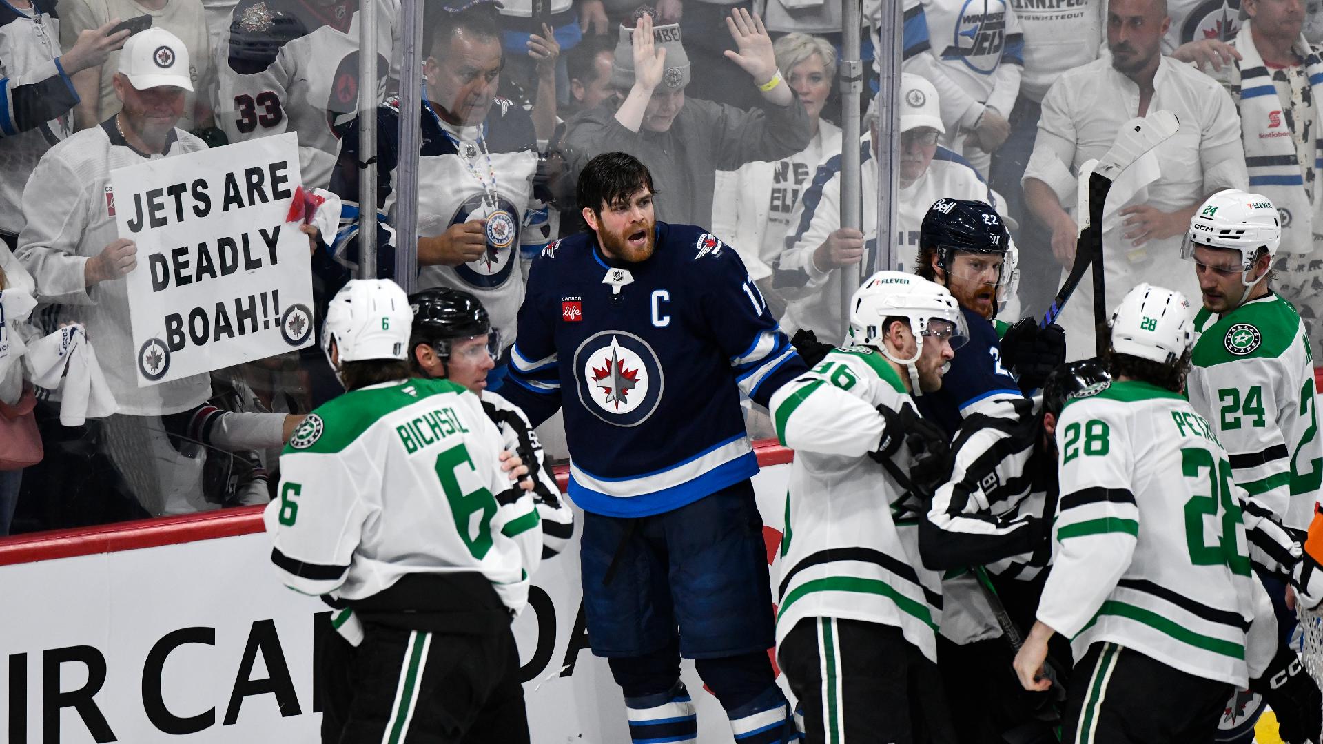 Dallas Stars captain Jamie Benn decks a Jets player and Stars fans ...