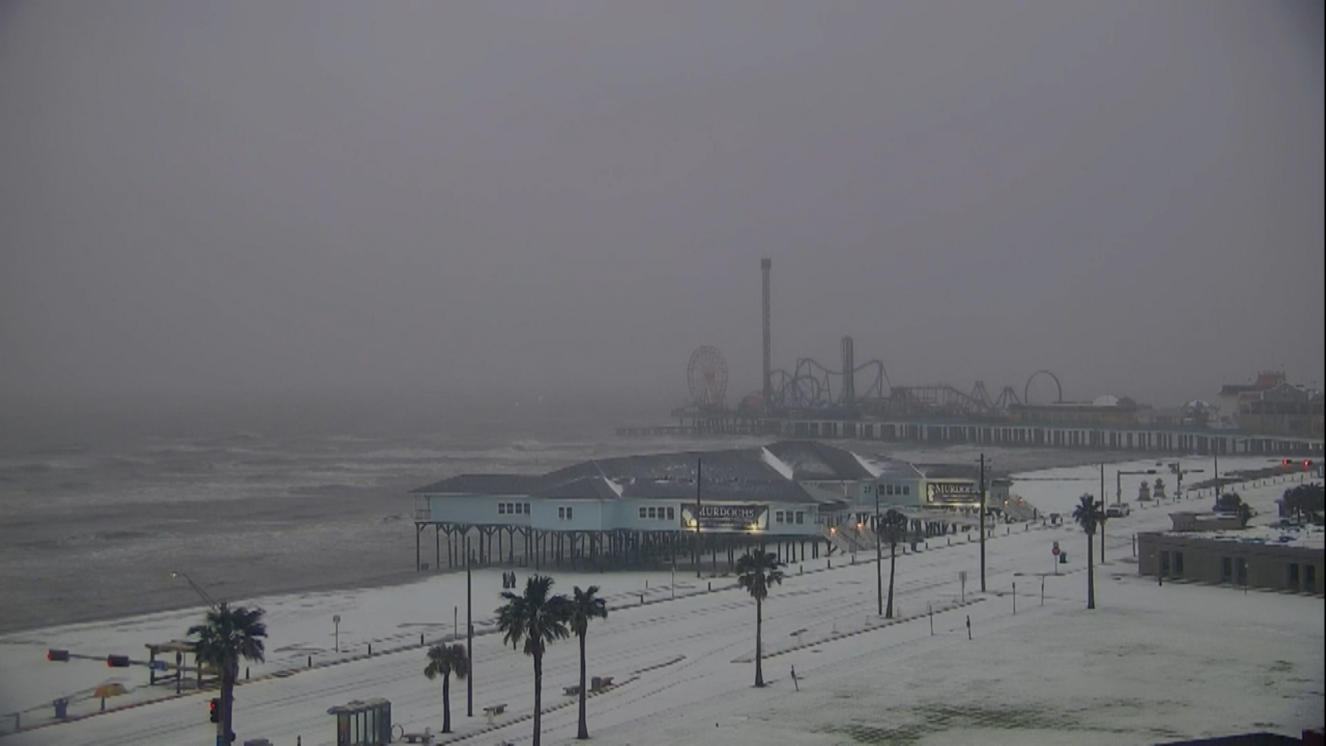 Rare snowfall coats the beach in Galveston | wfaa.com