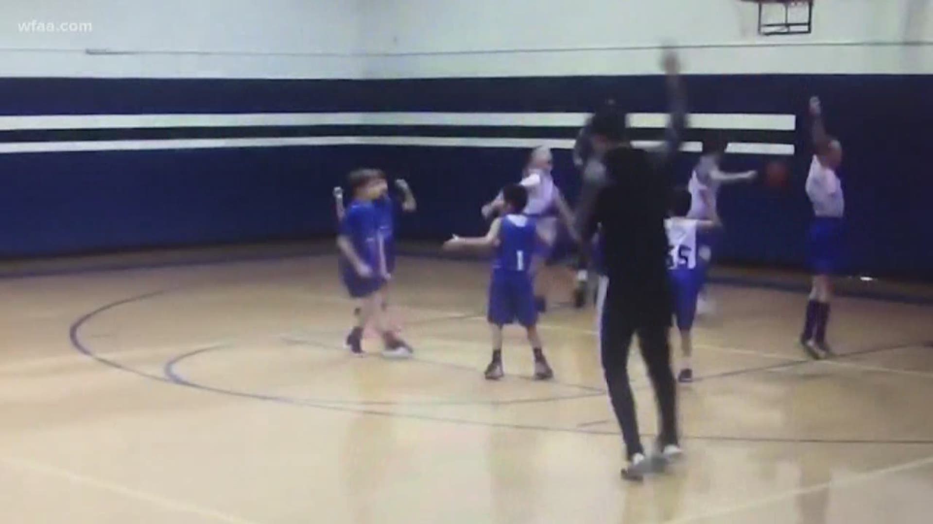 The crowd goes wild after a meaningful shot from a Quinlan basketball ...