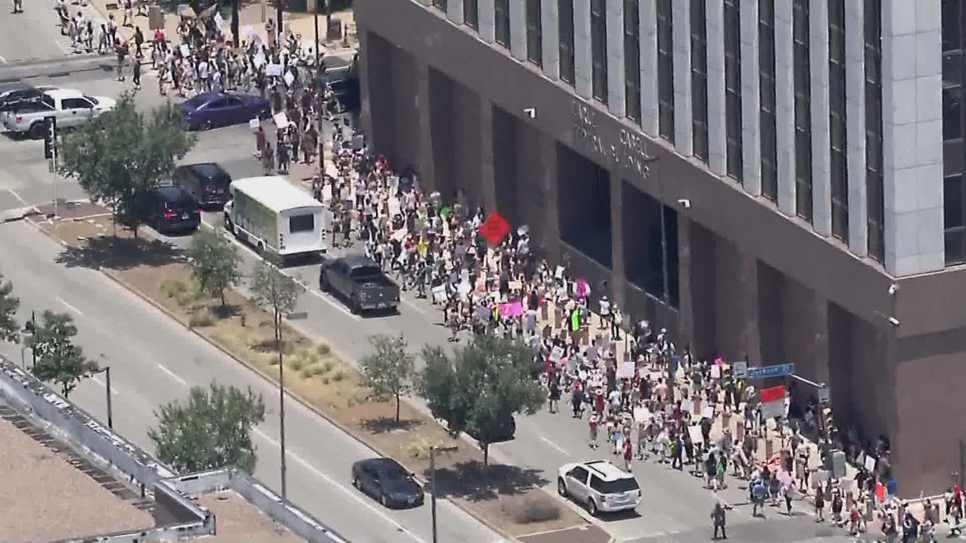 Protesters gather in downtown Dallas in response to overturning of Roe ...