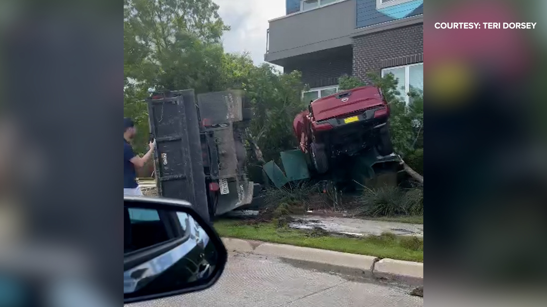 Dallas crash video shows red pickup, utility truck in bushes | wfaa.com