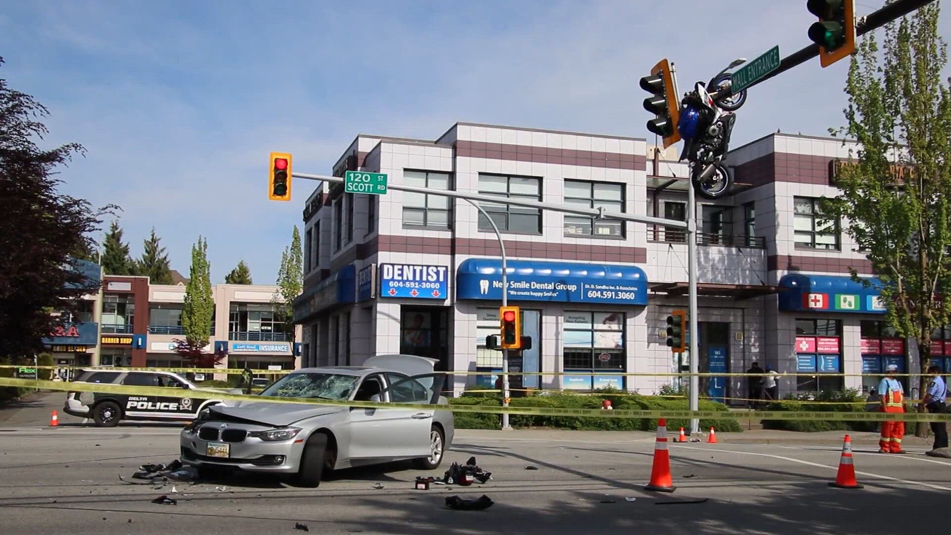Motorcycle seen dangling from a stoplight after a crash, severly ...