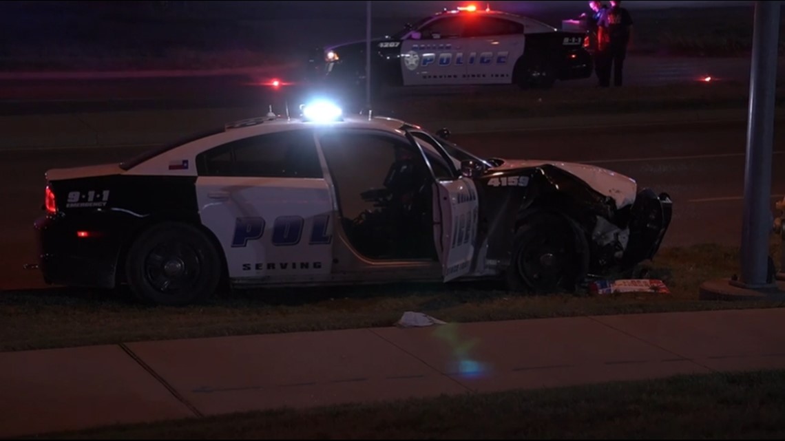 Dallas police officer taken to hospital after vehicle crashes into his ...