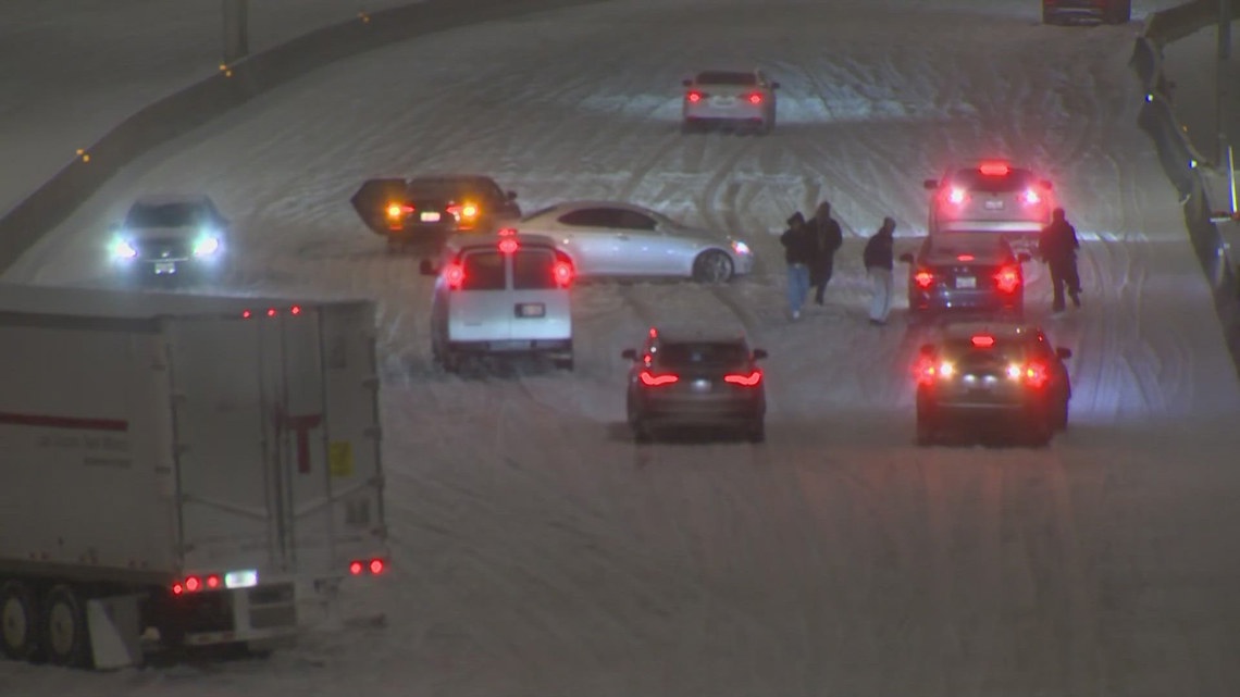 Multiple cars still stopped along eastbound Woodall Rodgers Freeway in ...