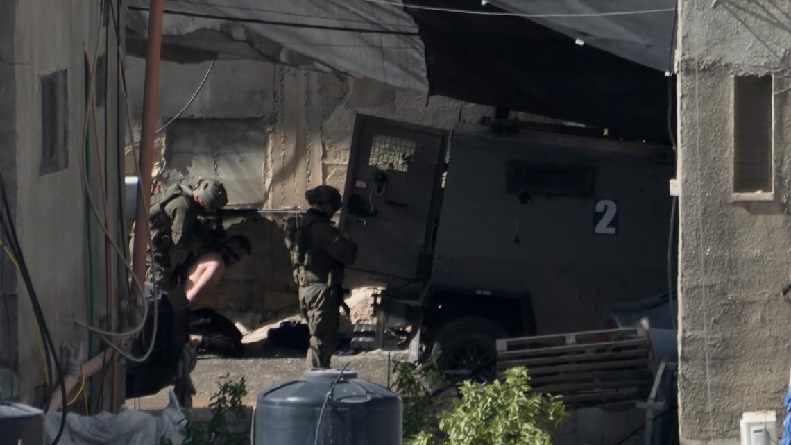 IDF soldiers push 3 bodies from roofs during West Bank raid | wfaa.com