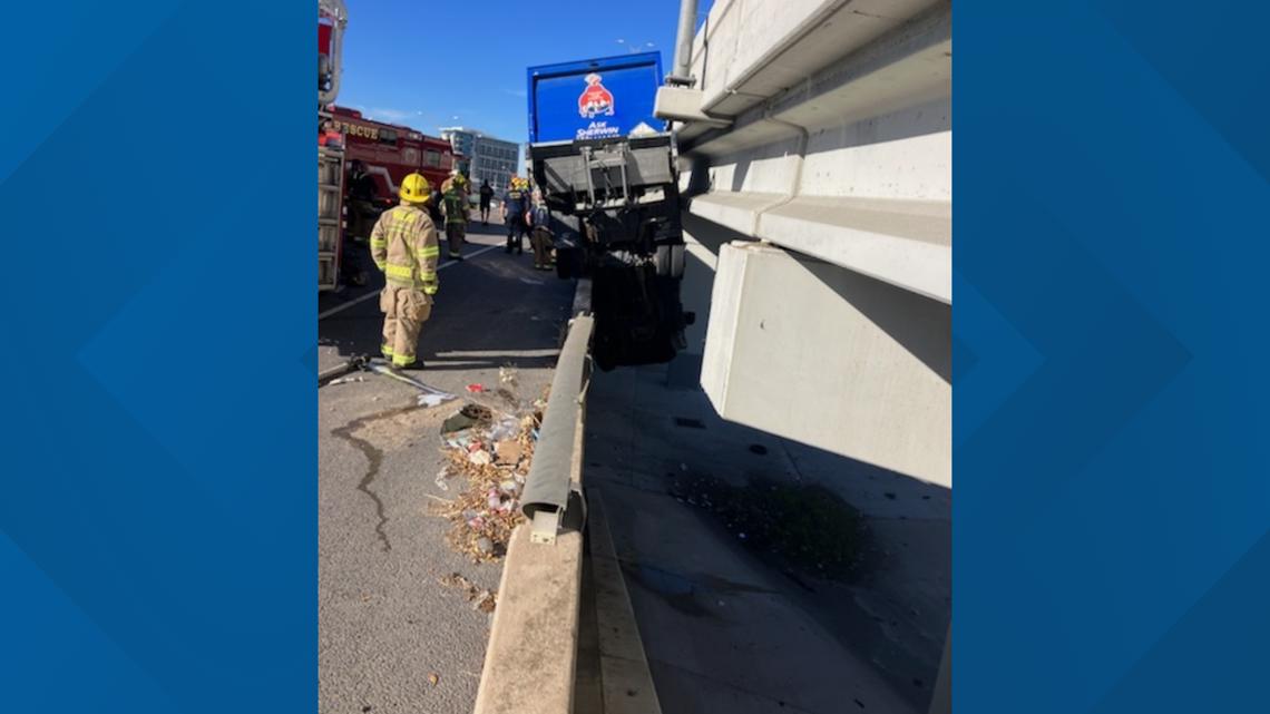 Sherwin Williams truck hanging off I-35 | wfaa.com