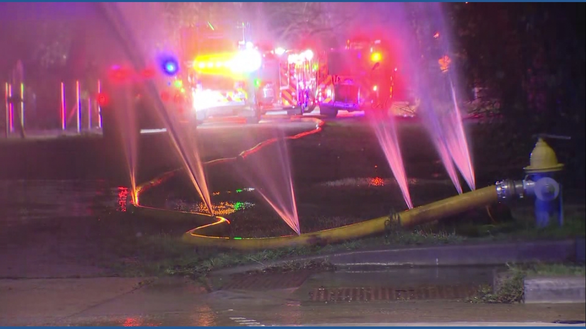 Woman reportedly starts house fire, stabs holes in fire hose of ...