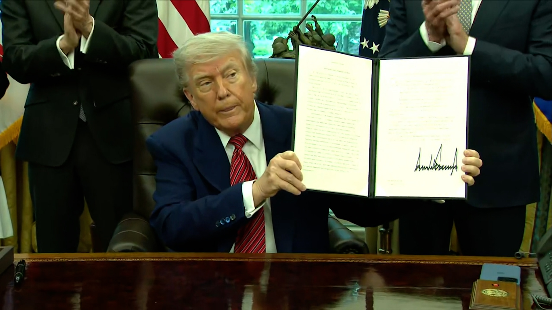 Donald Trump signs executive orders and answers questions from the ...