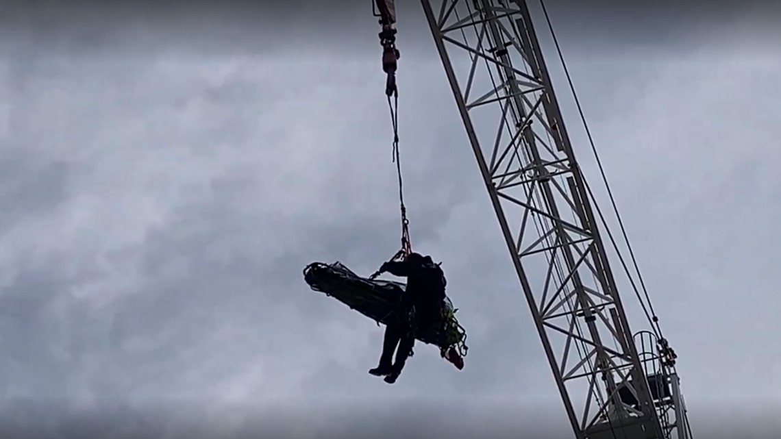 Rooftop rescue: DC firefighters rescue injured worker | wfaa.com