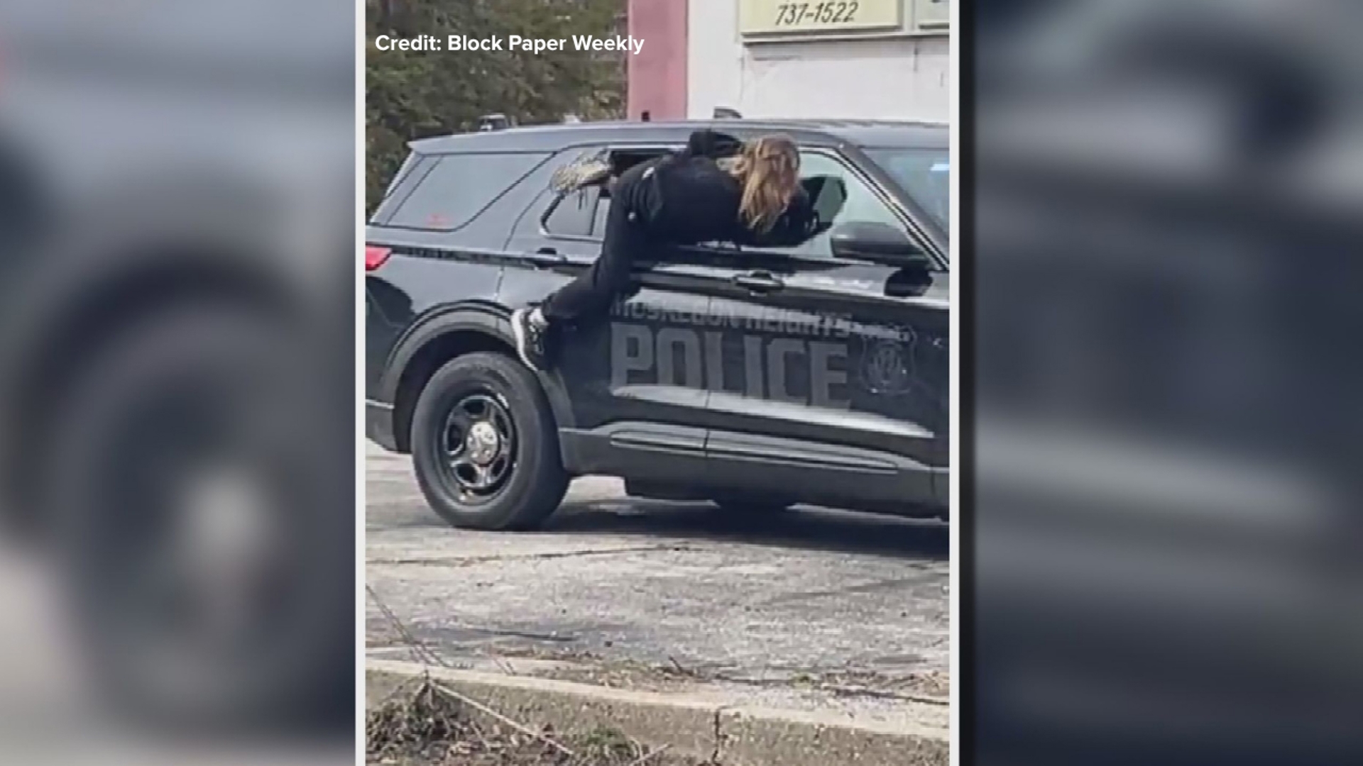Michigan woman who squeezed out of police car window while in handcuffs ...